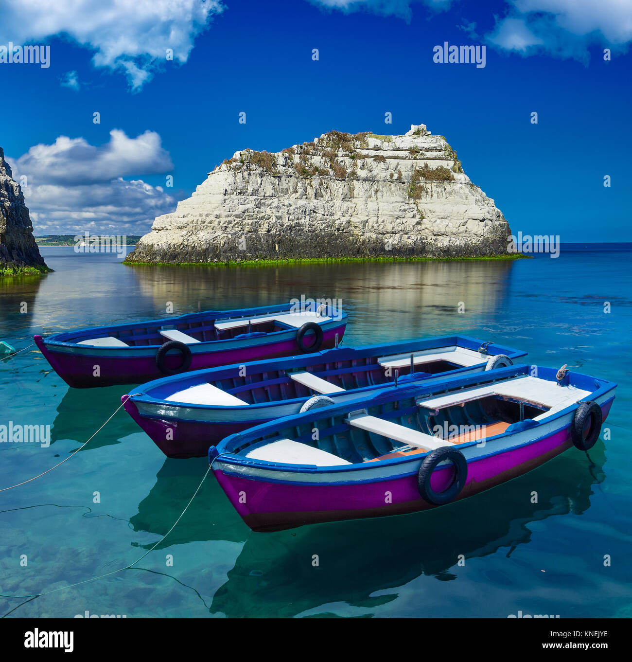 three colored boats Stock Photo - Alamy