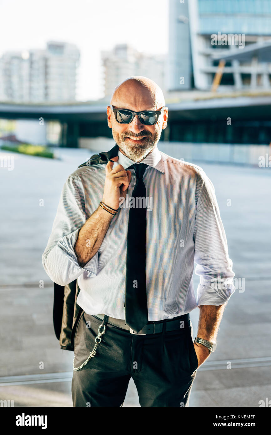Businessman carrying jacket over shoulder hi-res stock photography and ...