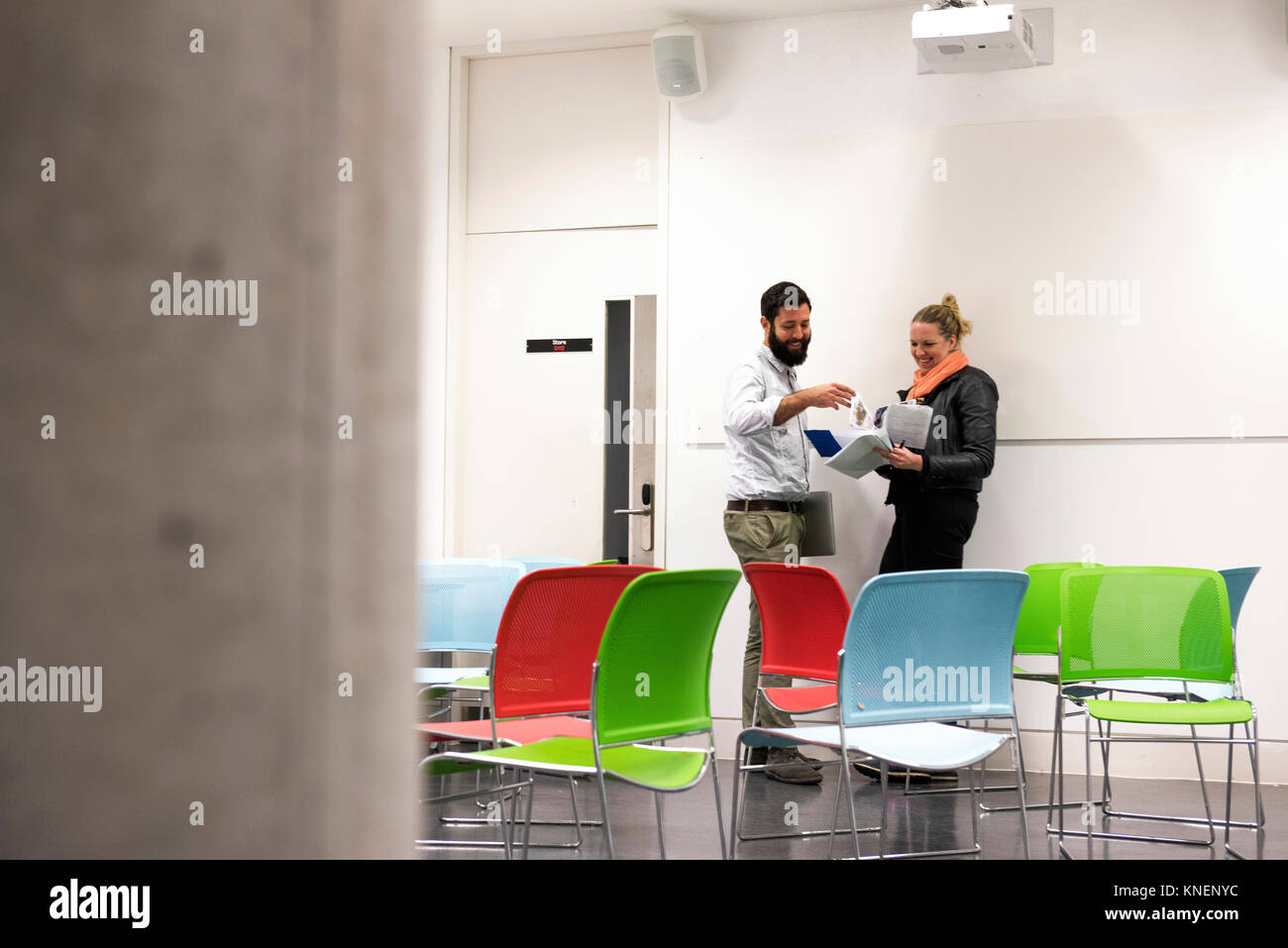 Male and female students comparing notes Stock Photo - Alamy