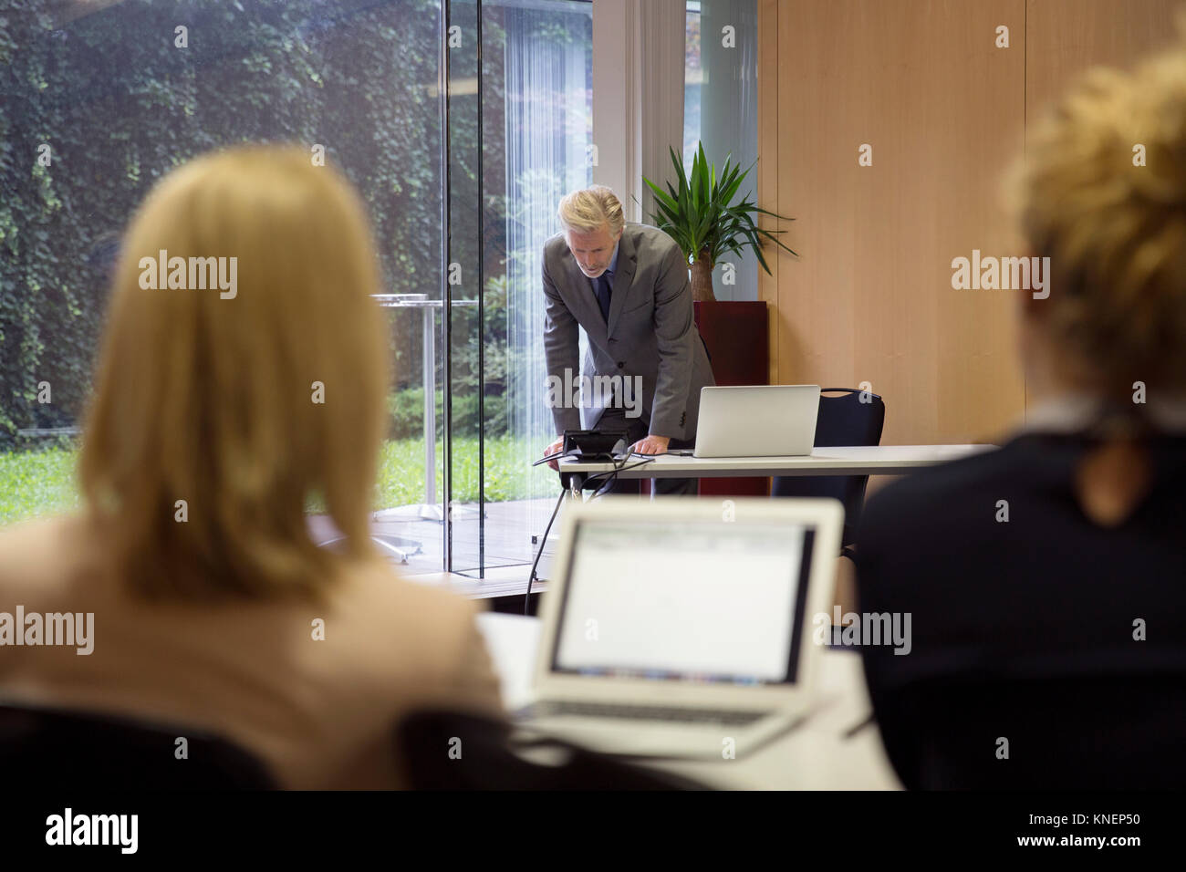 Colleagues having meeting in conference room Stock Photo - Alamy
