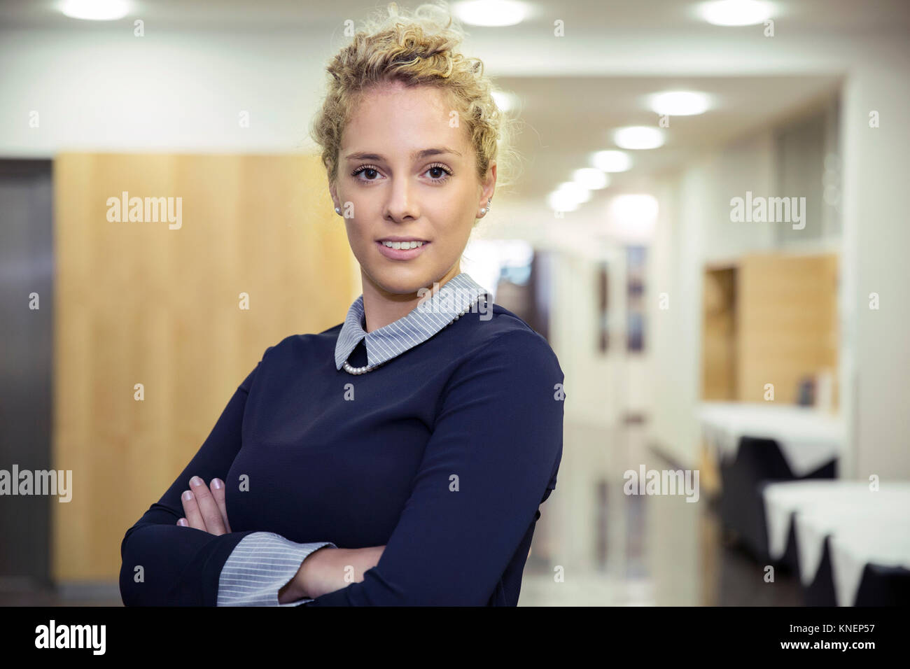 Portrait of woman in office looking at camera Stock Photo - Alamy
