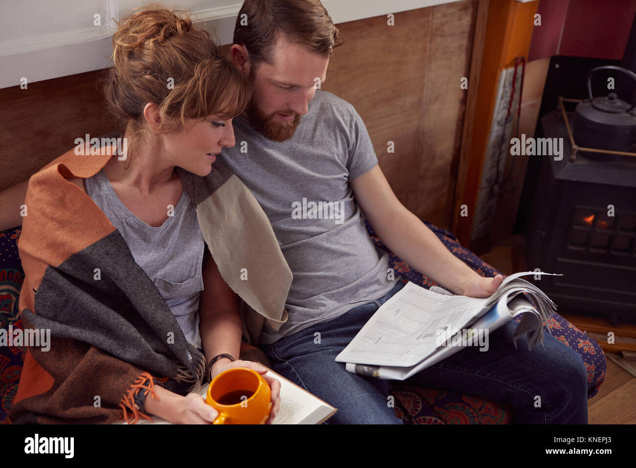Couple reading together Stock Photo - Alamy