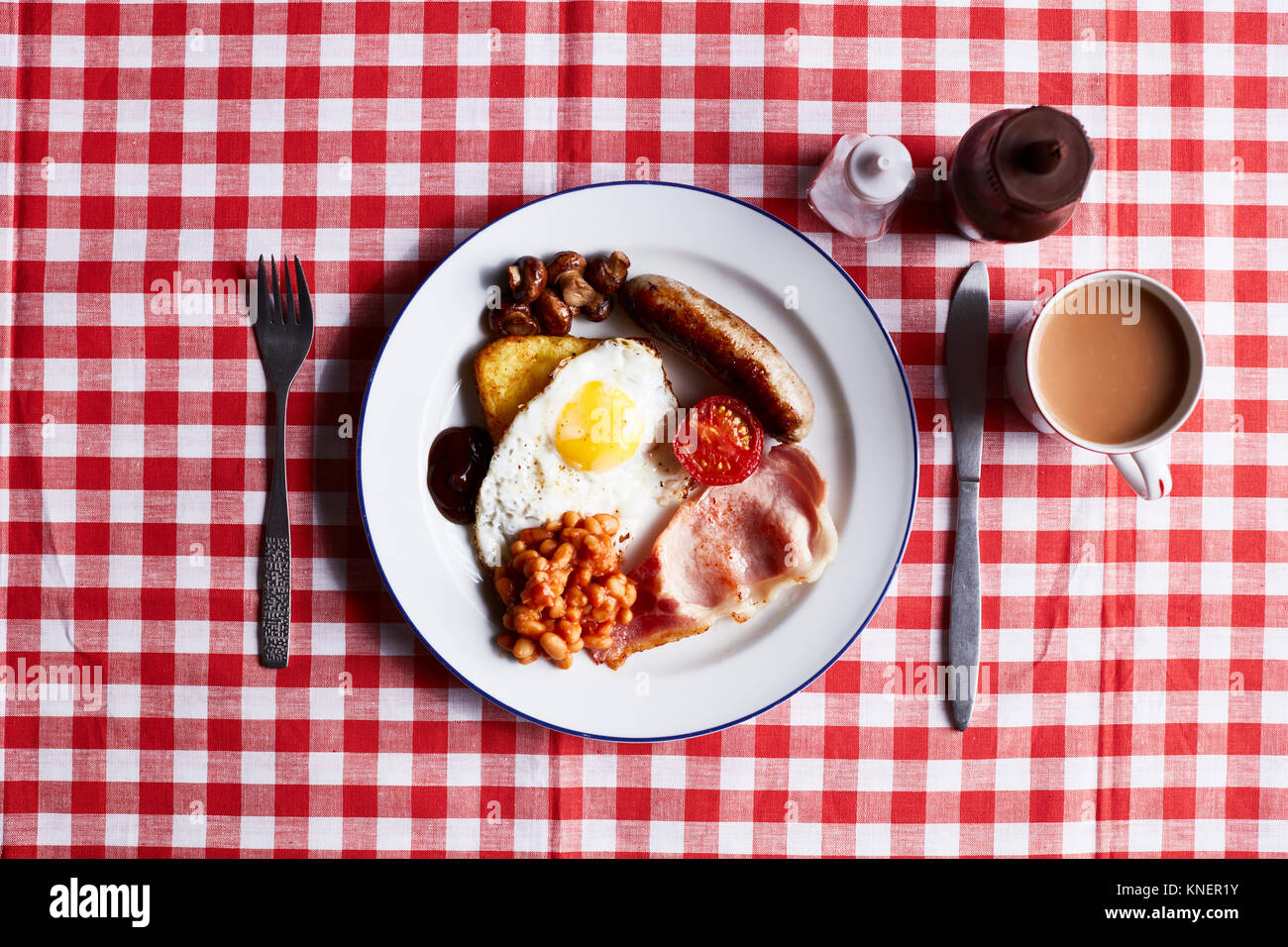 Full English breakfast on checked table cloth, overhead view Stock ...