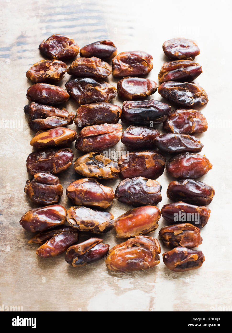 Dried dates in rows, close-up Stock Photo - Alamy