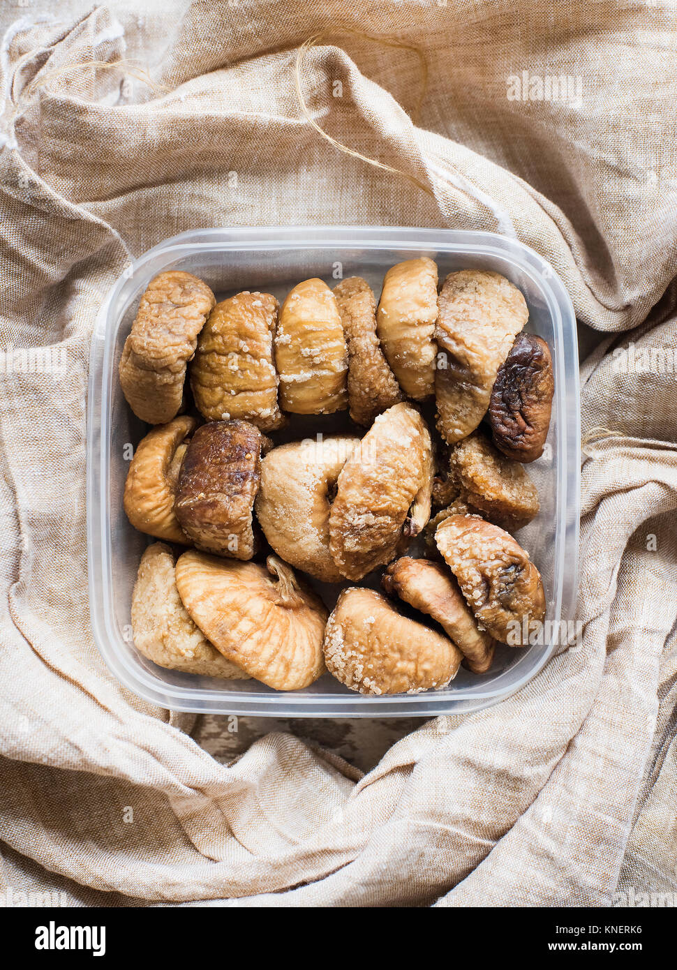 Dried figs in plastic container, close-up Stock Photo - Alamy