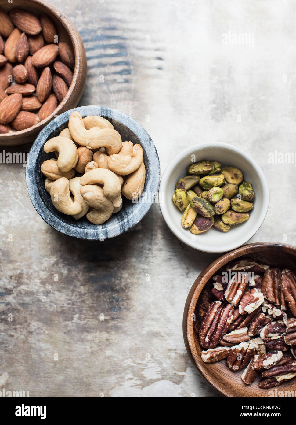 Variety of mixed nuts in bowls, close-up Stock Photo - Alamy