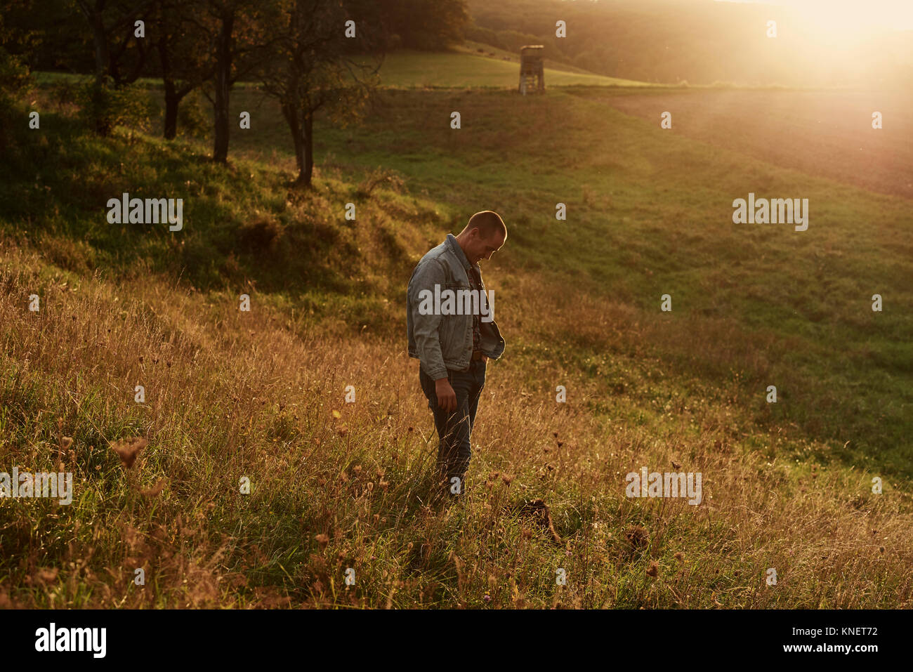 Old Man Standing Looking Down