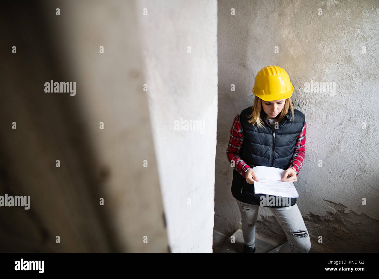 Young woman worker on the building site Stock Photo - Alamy