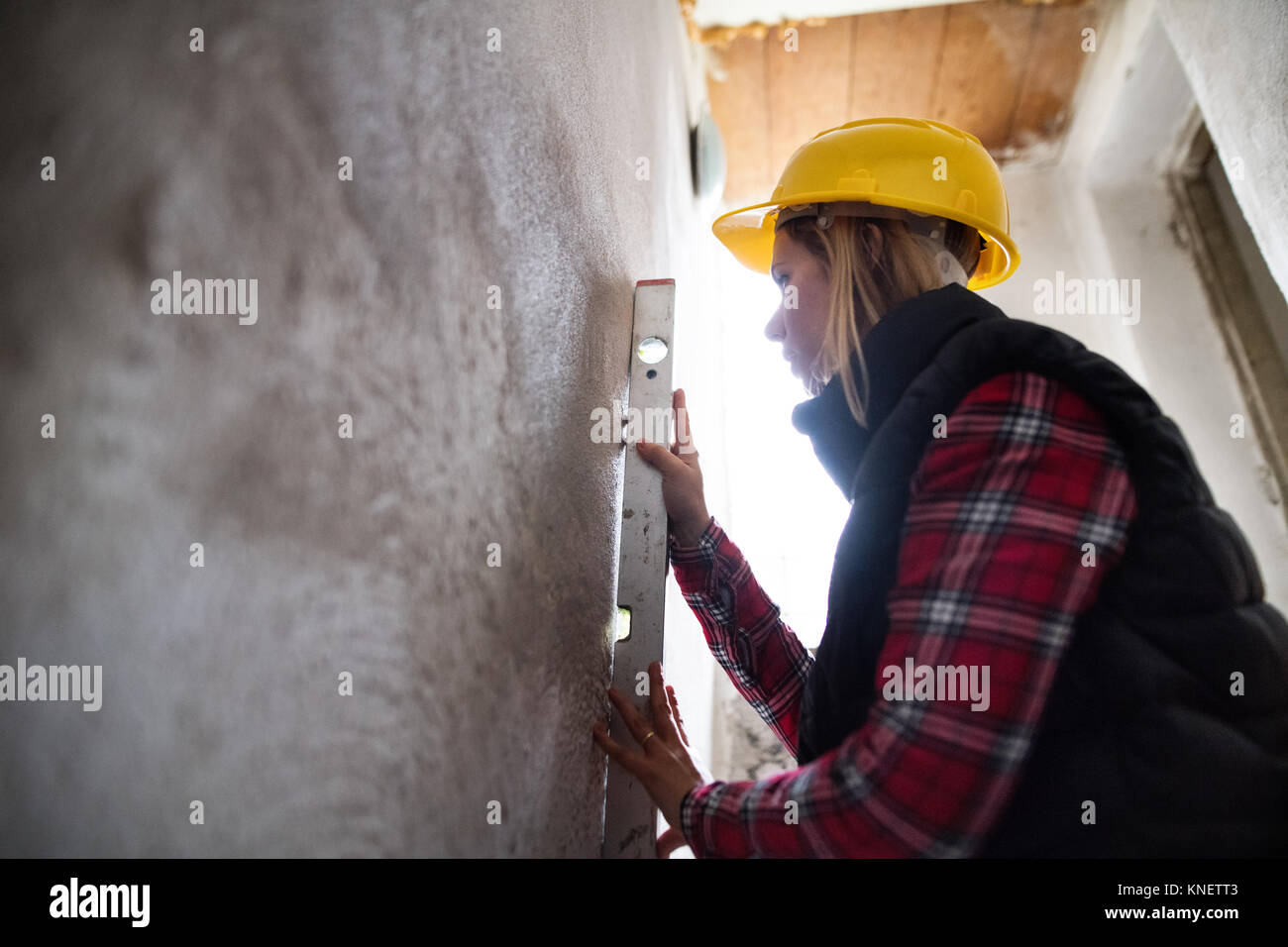 Young woman worker on the construction site Stock Photo - Alamy