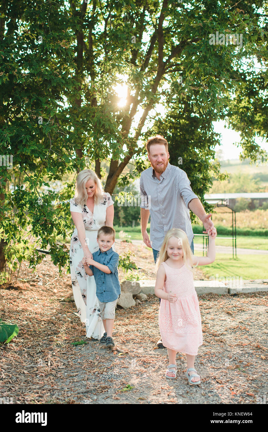 Children leading parents by the hand Stock Photo - Alamy