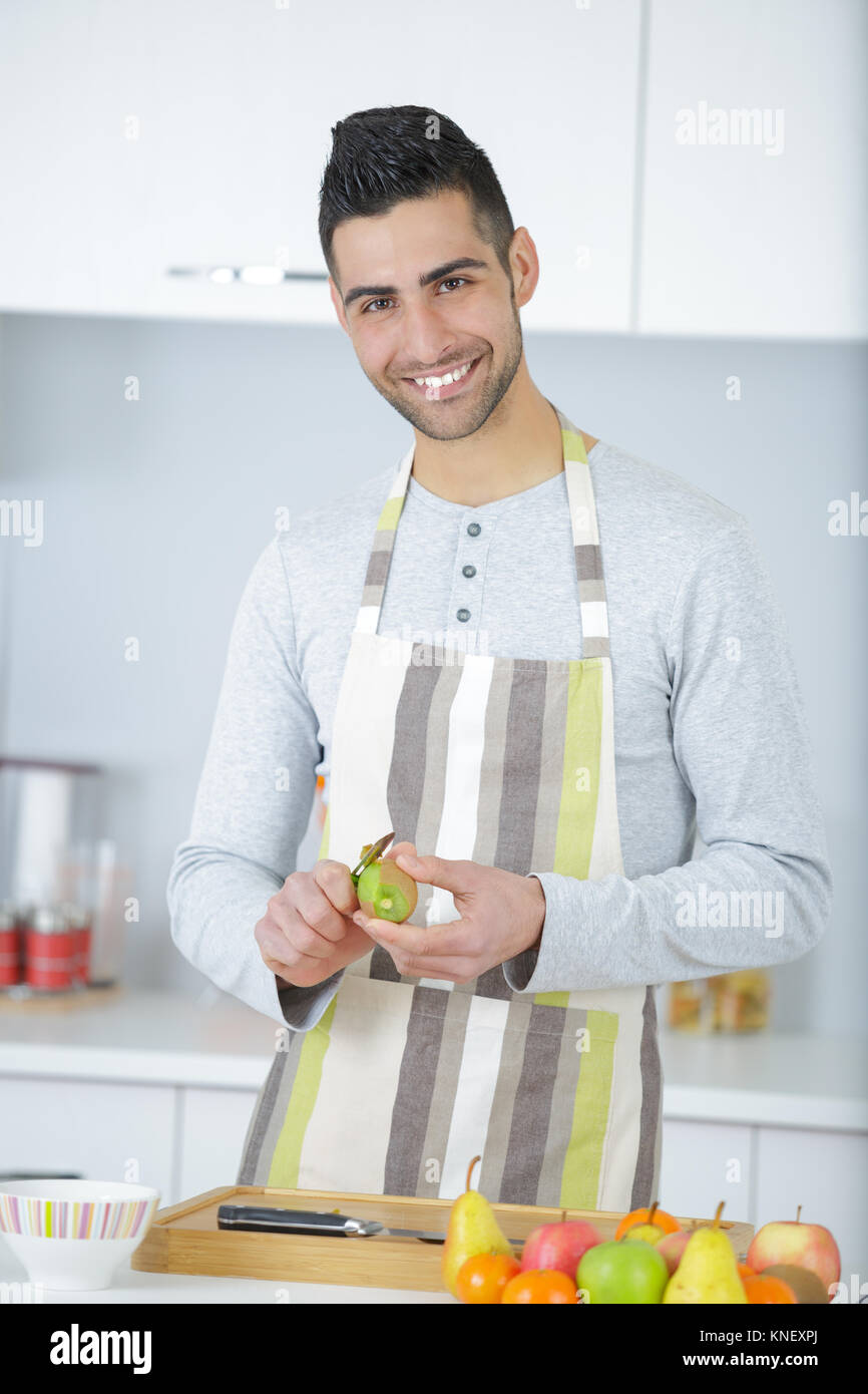 a man cutting apple Stock Photo - Alamy
