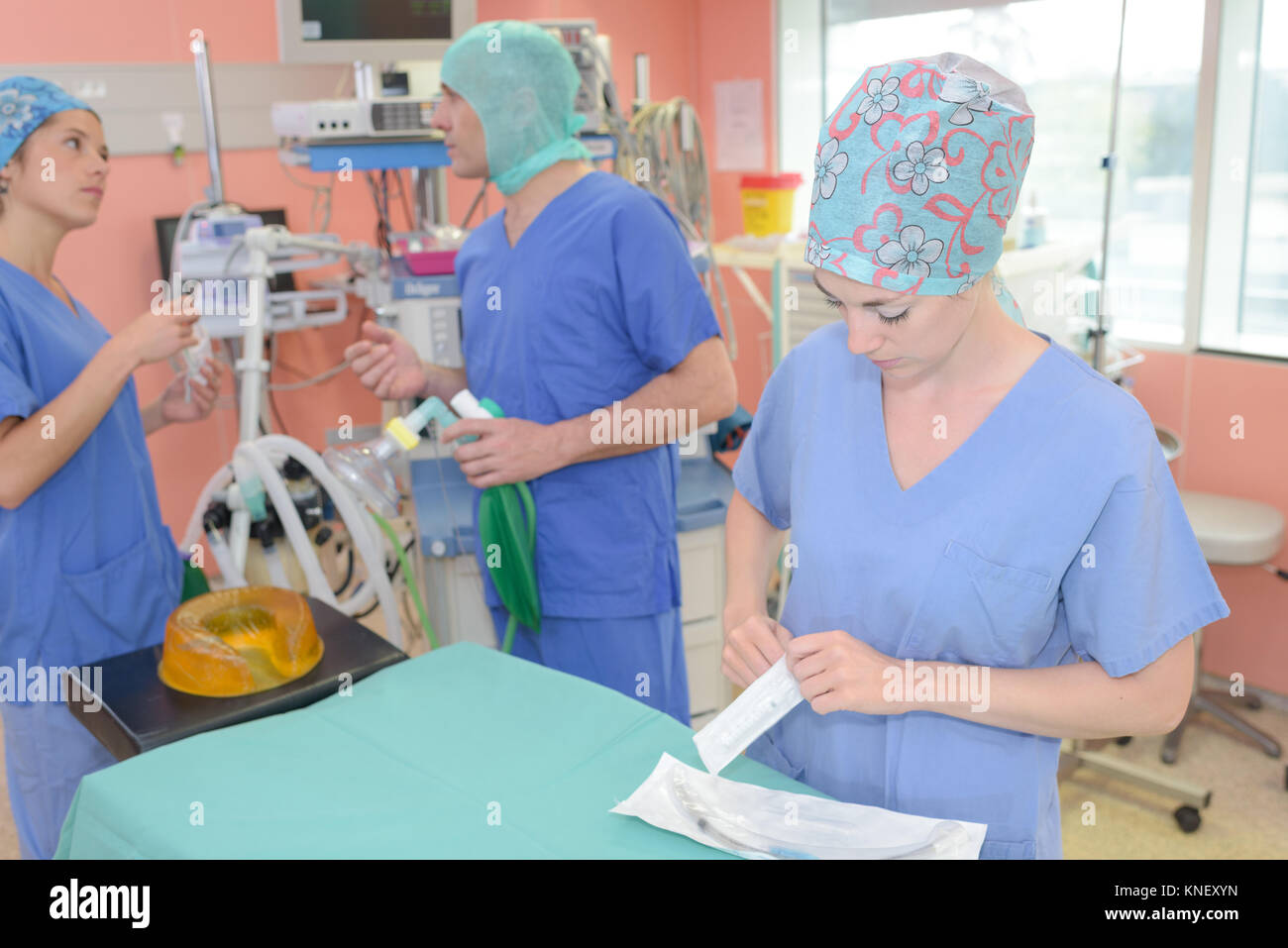 team of surgeons in the dark operating room Stock Photo - Alamy