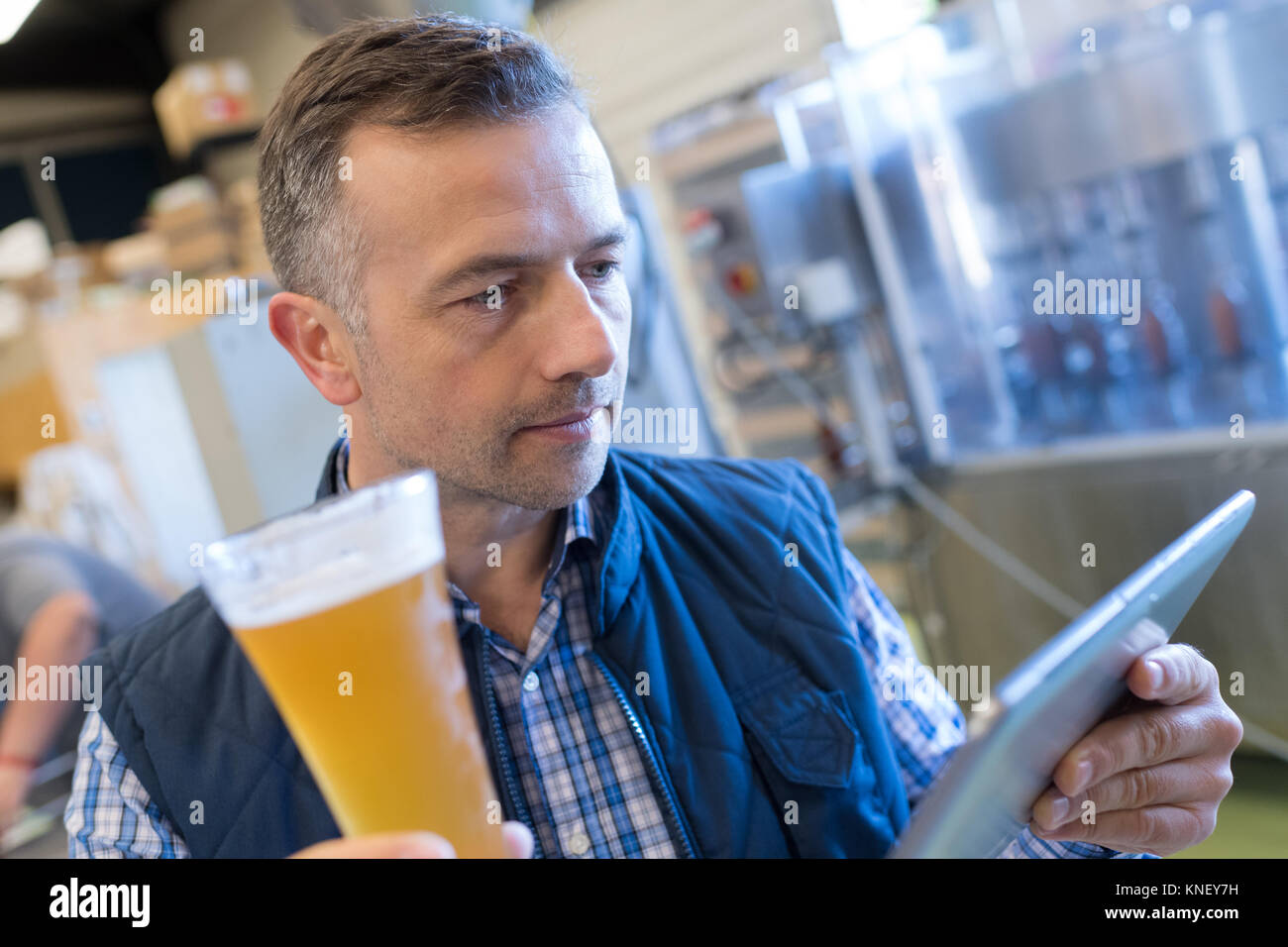 handsome man working in brewery Stock Photo - Alamy
