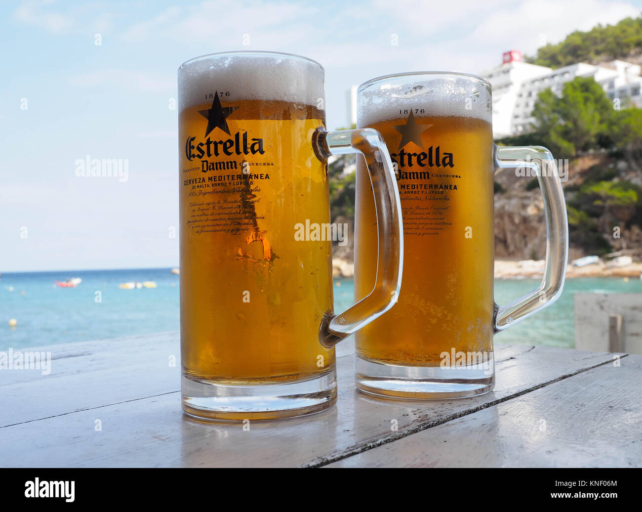 TWO LARGE GLASSES OF ESTRELLA LAGER BEER ON TABLE OF RESTAURANT ...