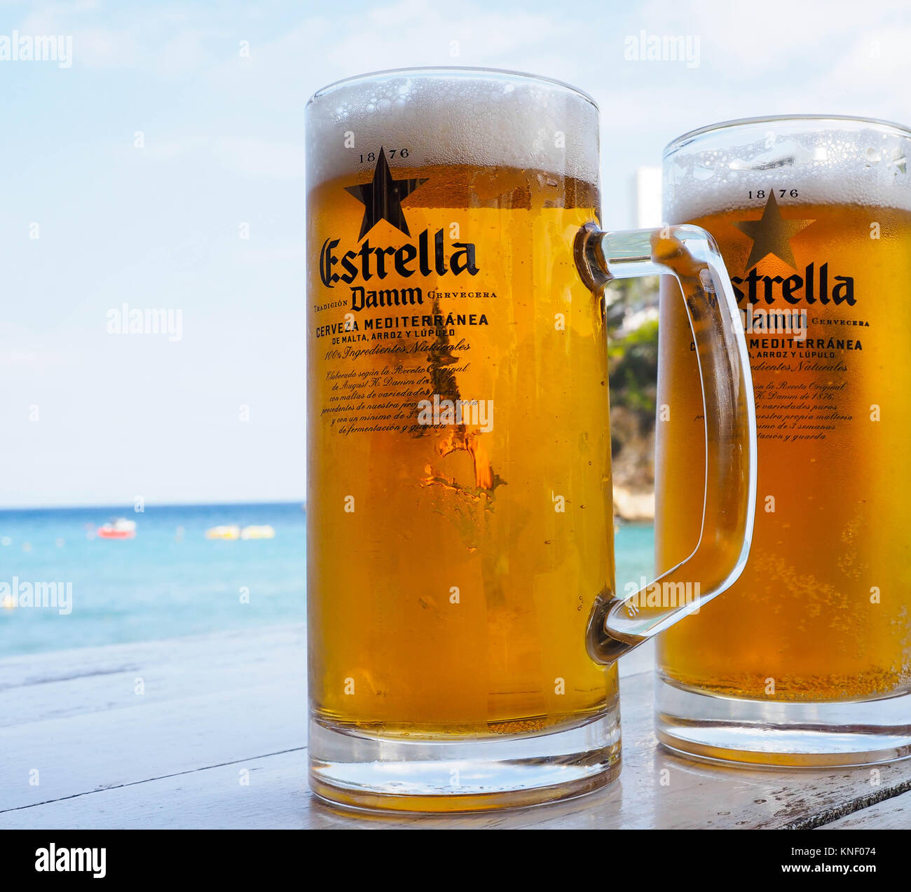 TWO LARGE GLASSES OF ESTRELLA LAGER BEER ON TABLE OF RESTAURANT ...