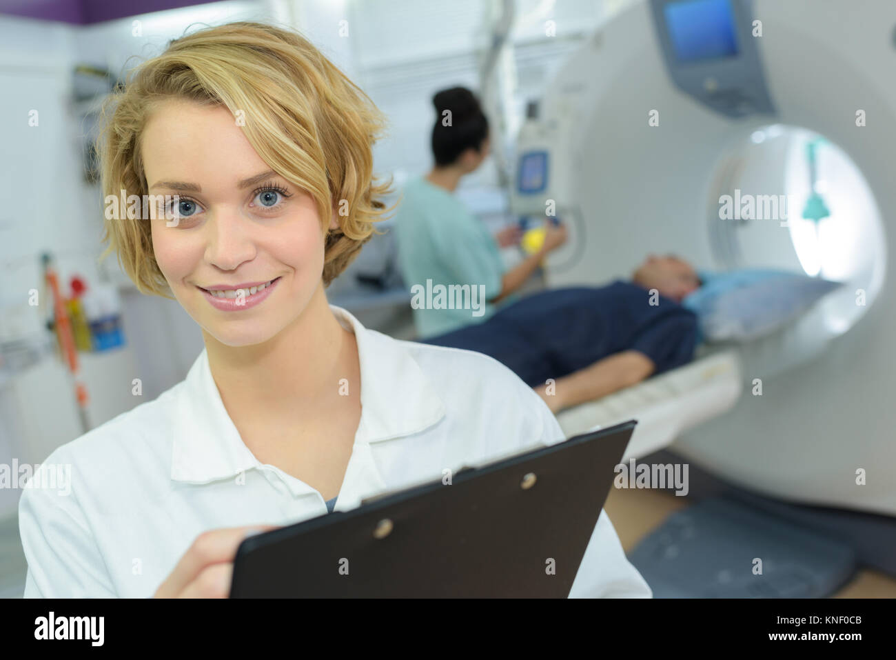 happy radiologic technician in mri room Stock Photo - Alamy