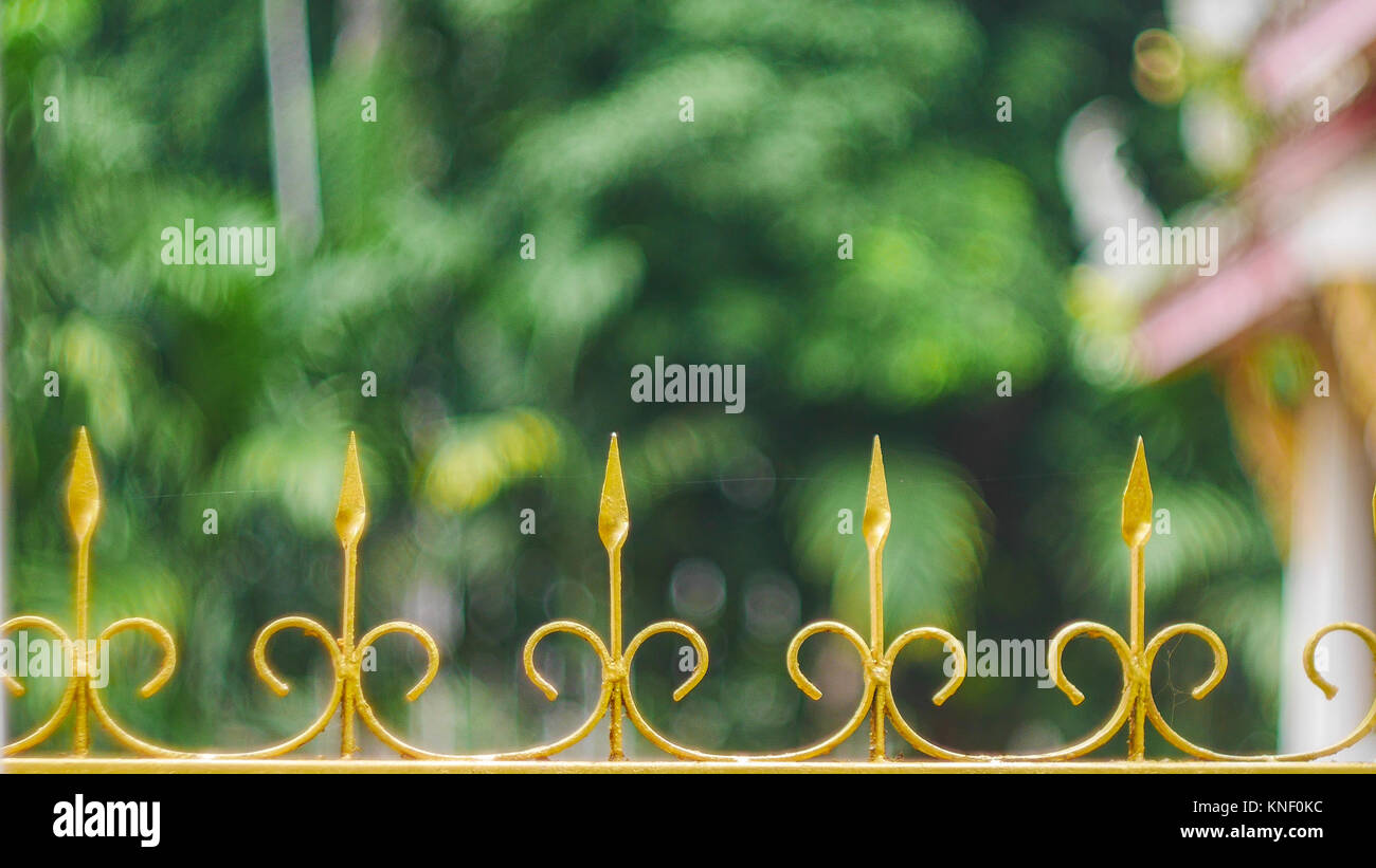 wrought iron , The yellow sharp curved steel on the wall and the fence ...