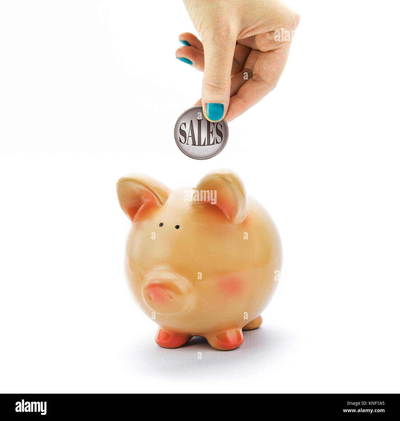 Hand depositing coin with Sales text in piggy bank Stock Photo - Alamy