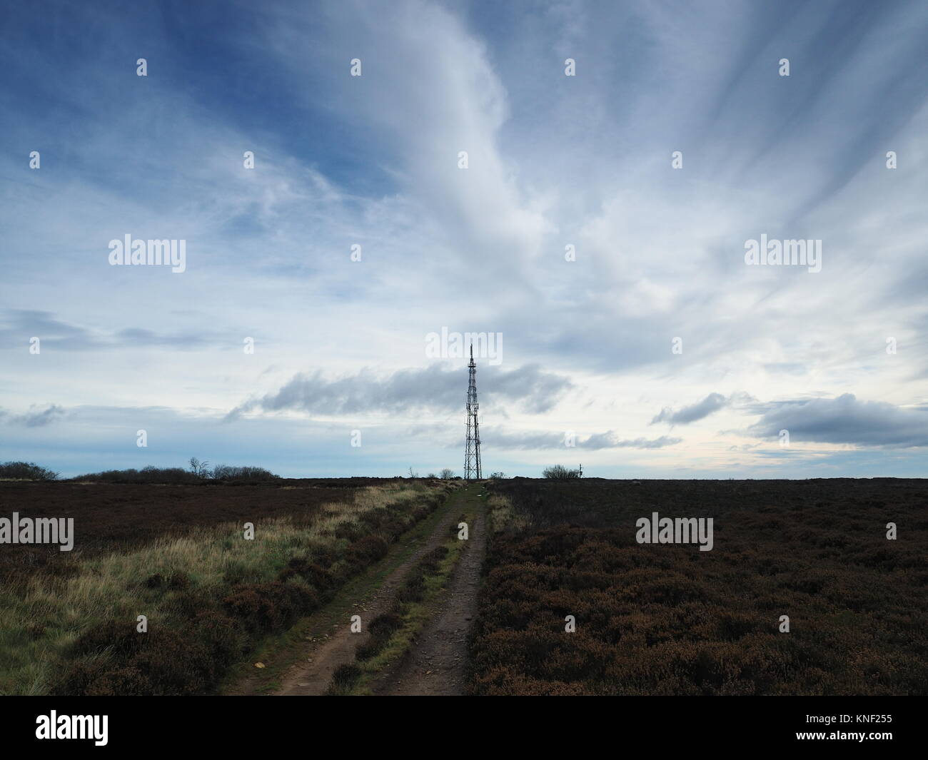 Transmitter mast on moors under brooding sky Stock Photo - Alamy