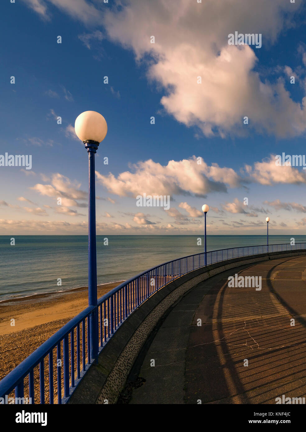 Seaside promenade scene with lamp stands and railings Stock Photo - Alamy
