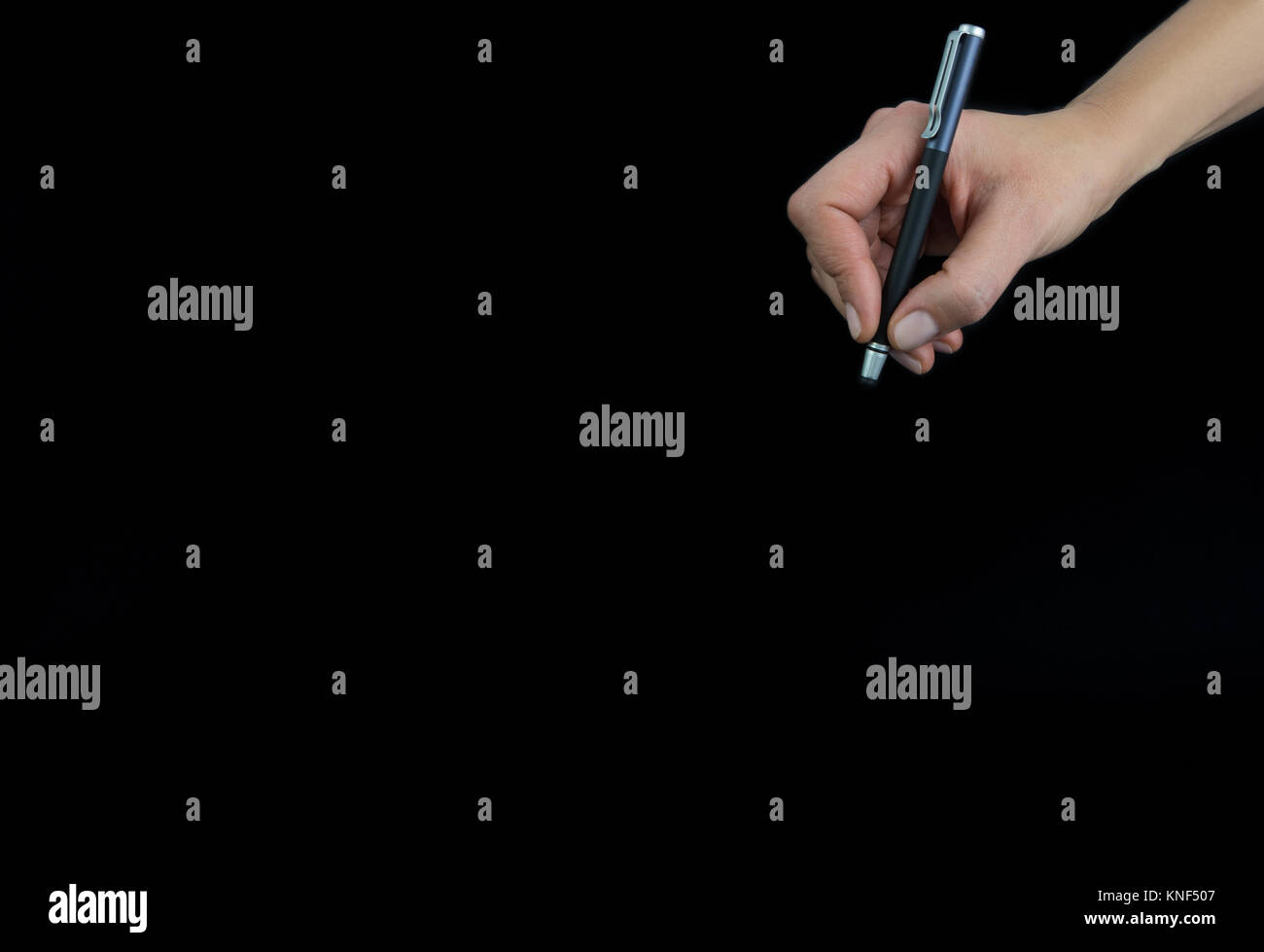 Hand holding stylus isolated on black background Stock Photo - Alamy