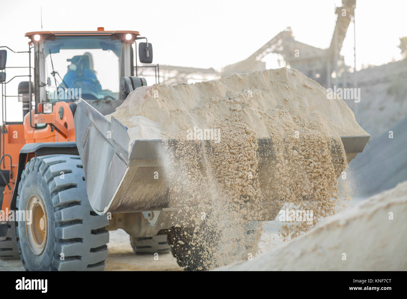 Quarry worker using heavy machinery in quarry Stock Photo - Alamy