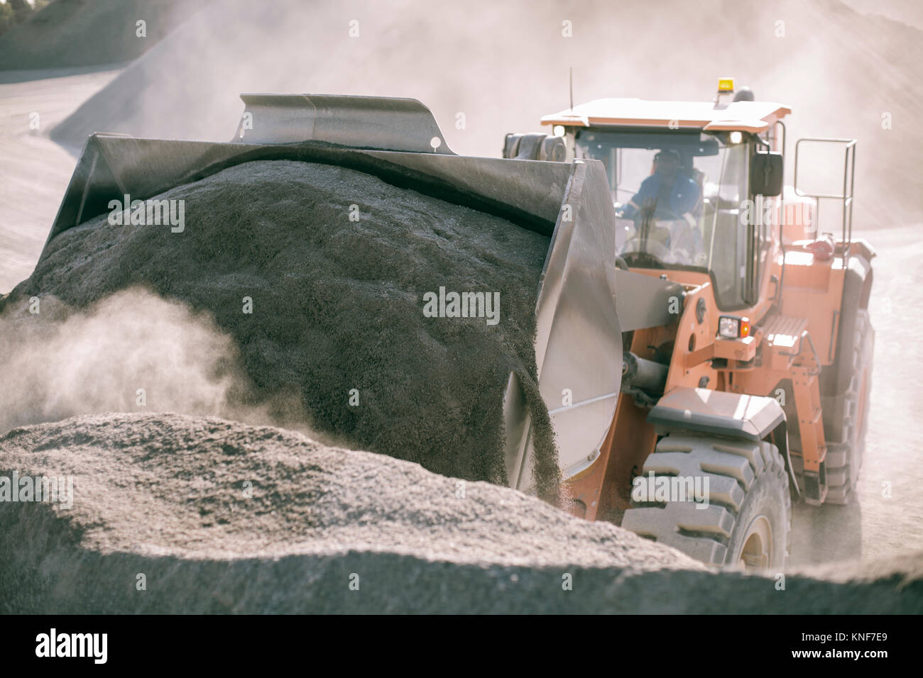 Quarry worker using heavy machinery in quarry Stock Photo - Alamy