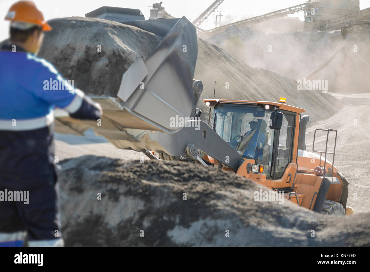 Quarry worker using heavy machinery in quarry Stock Photo - Alamy