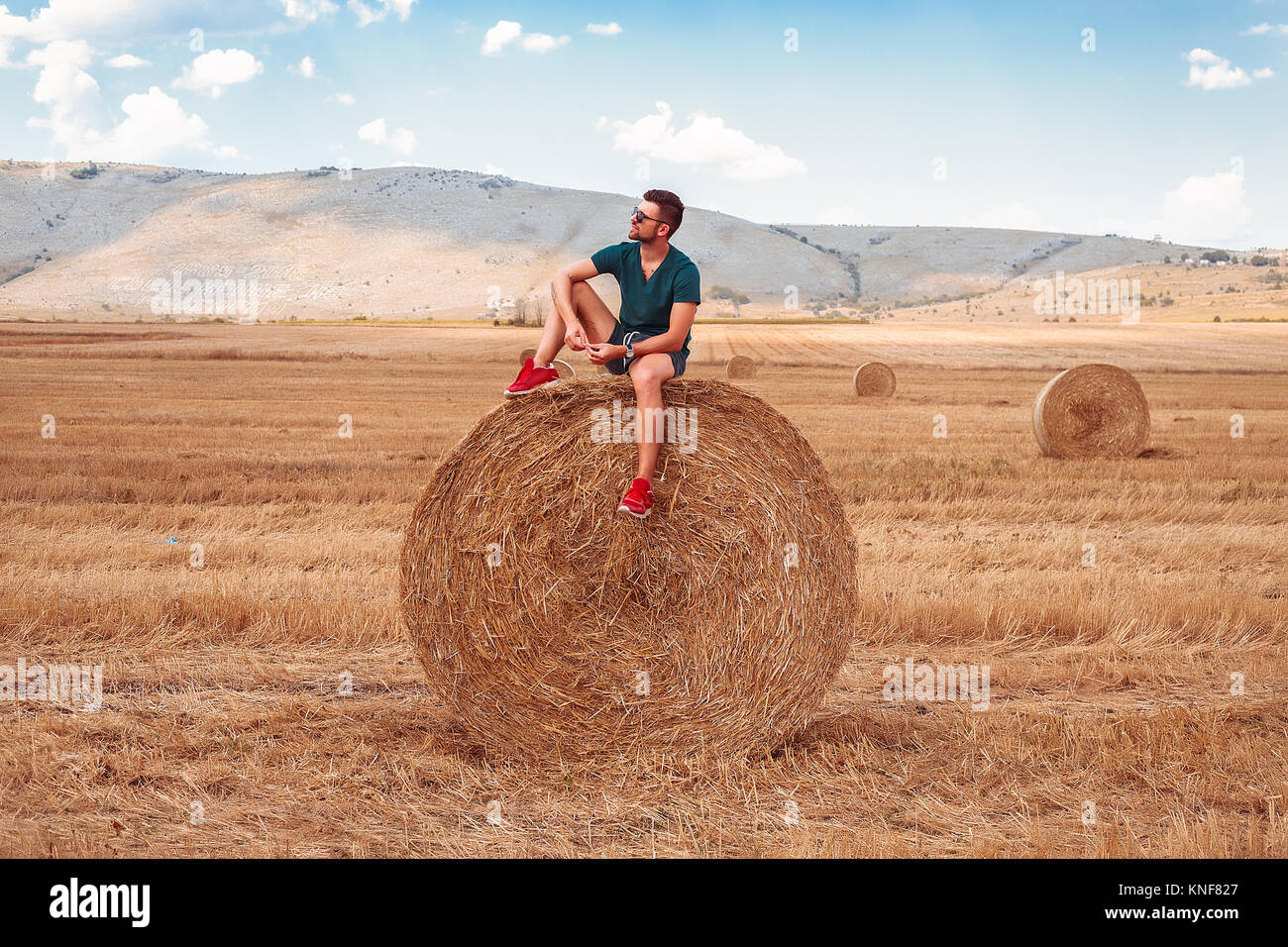 Man sitting on bale hi-res stock photography and images - Alamy