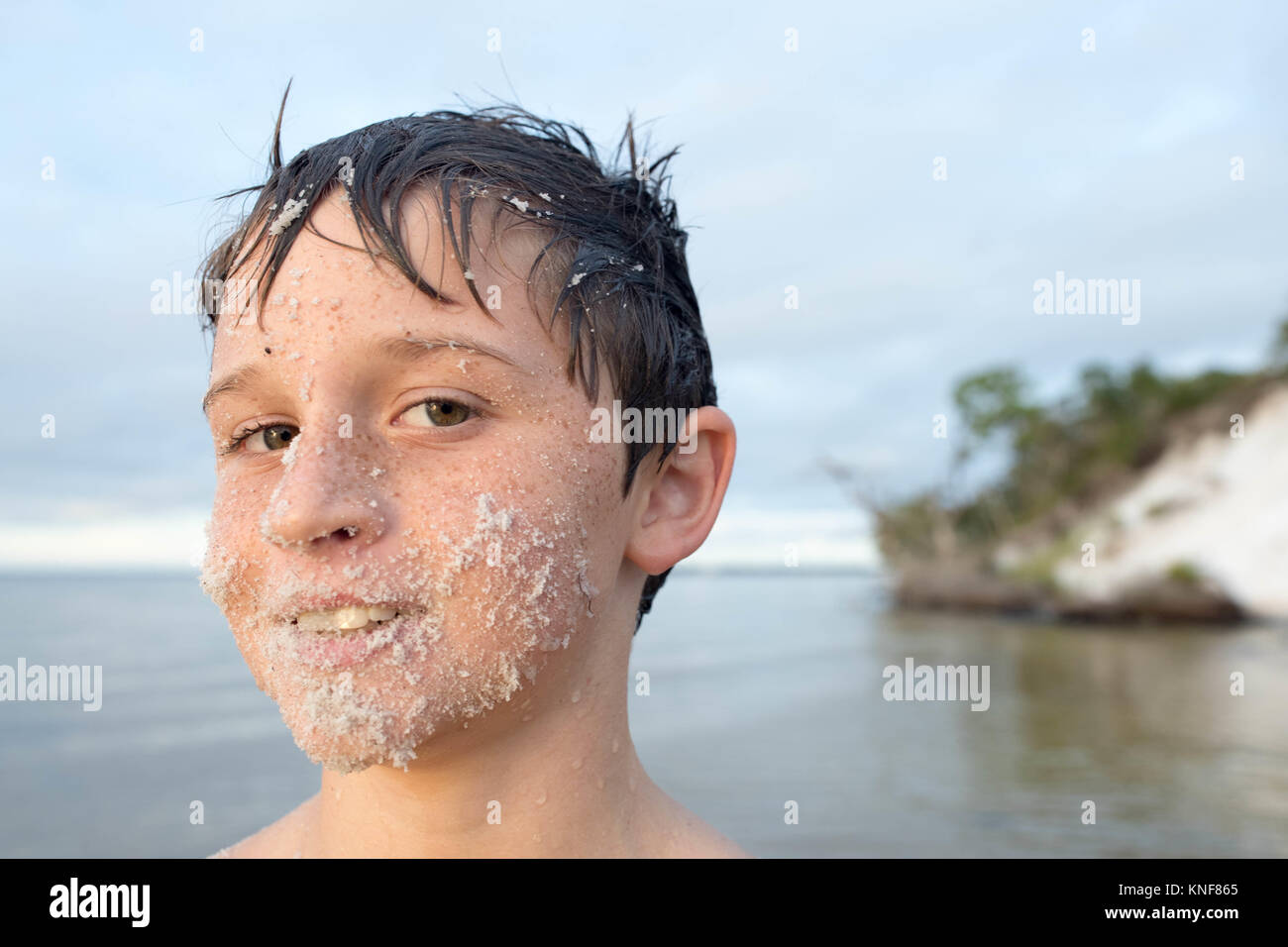 Boy with sand on face Stock Photo - Alamy