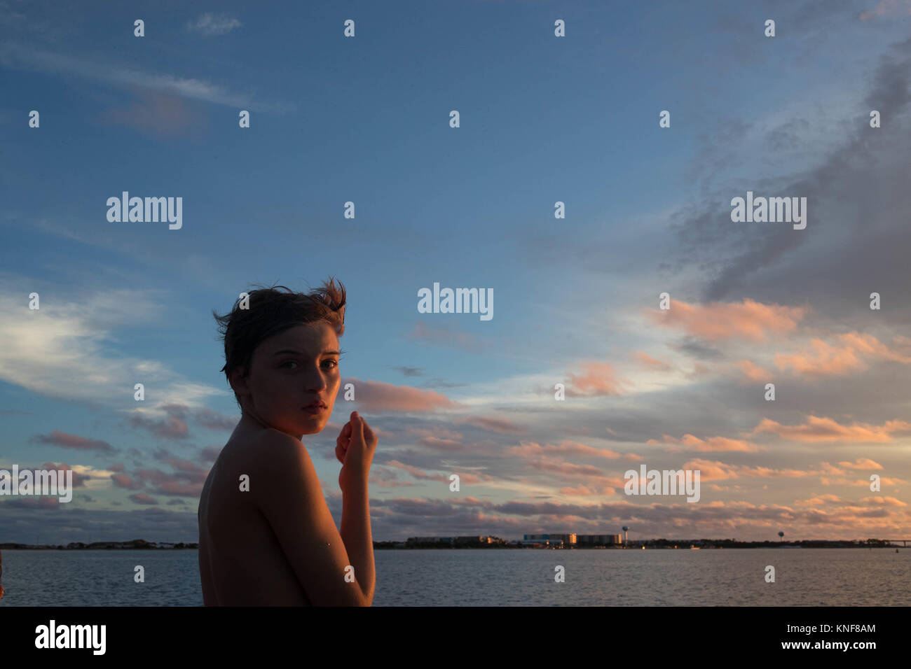 Boy looking at sunset hi-res stock photography and images - Alamy