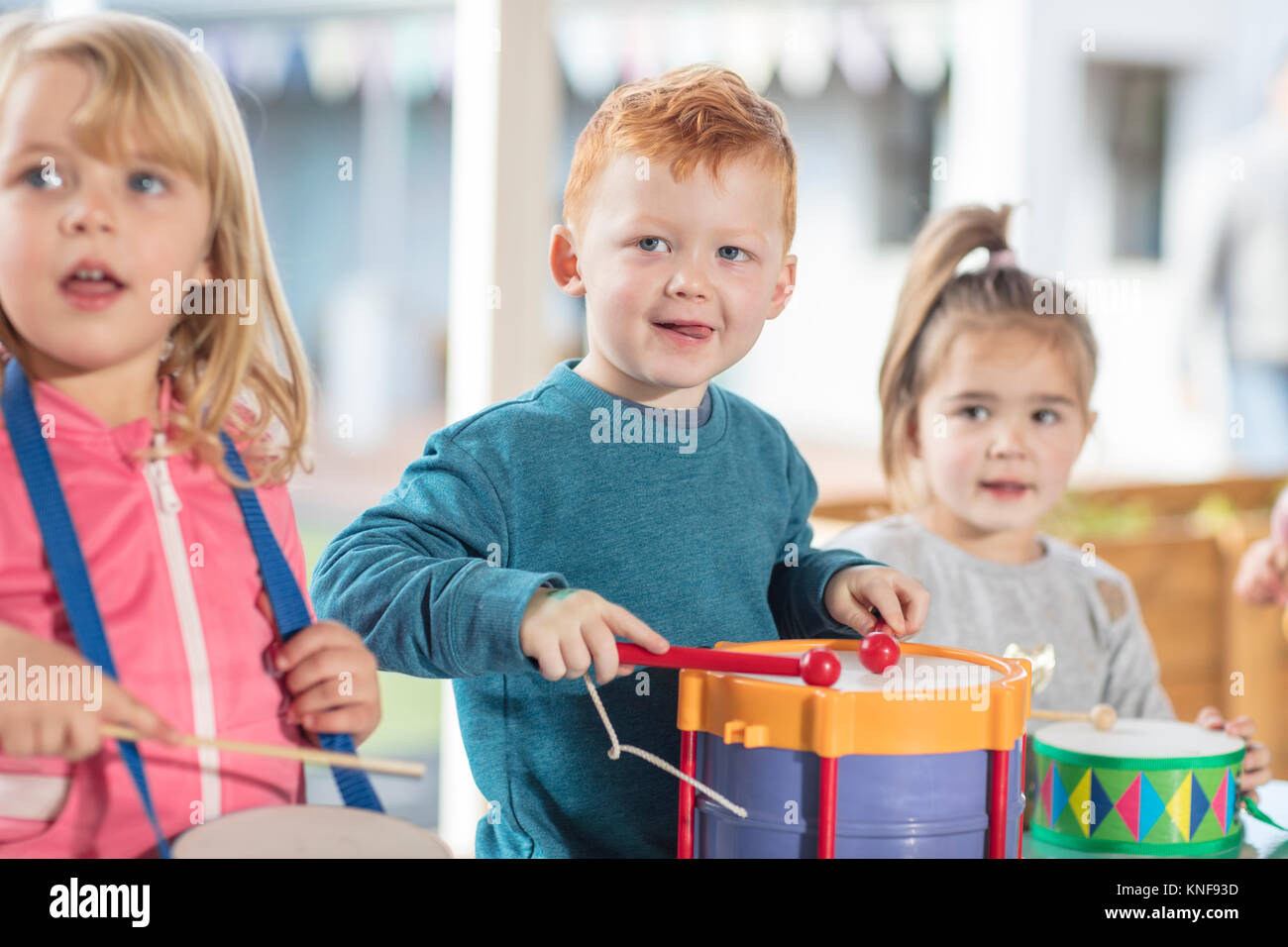 Children playing musical instruments hi-res stock photography and ...