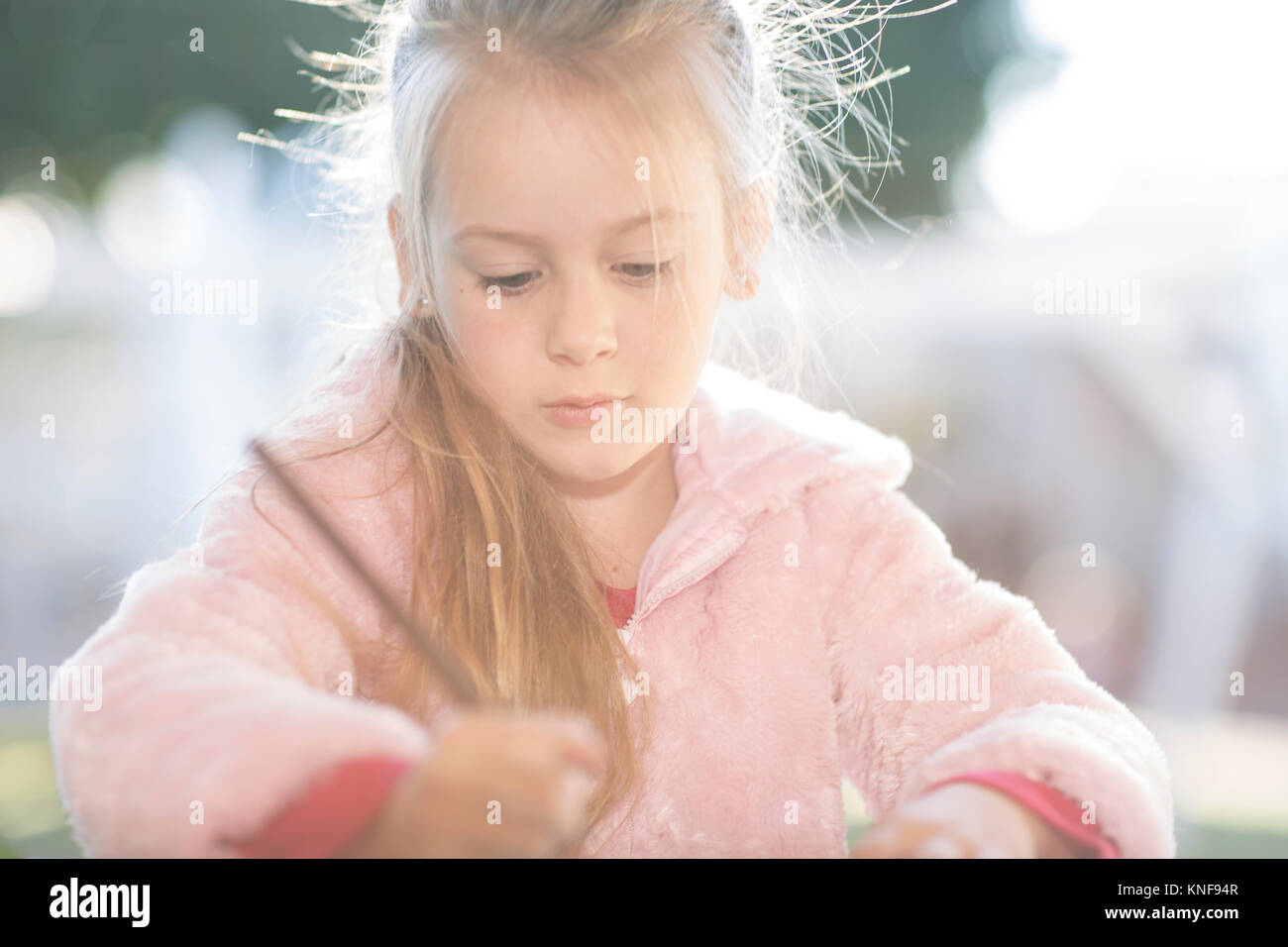 Young girl, outdoors, drawing Stock Photo - Alamy