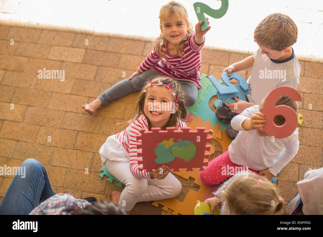 Children playing with numbers hi-res stock photography and images - Alamy