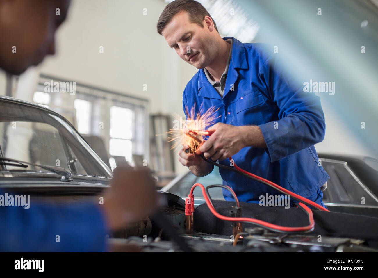 Car mechanics testing car engine in repair garage Stock Photo - Alamy