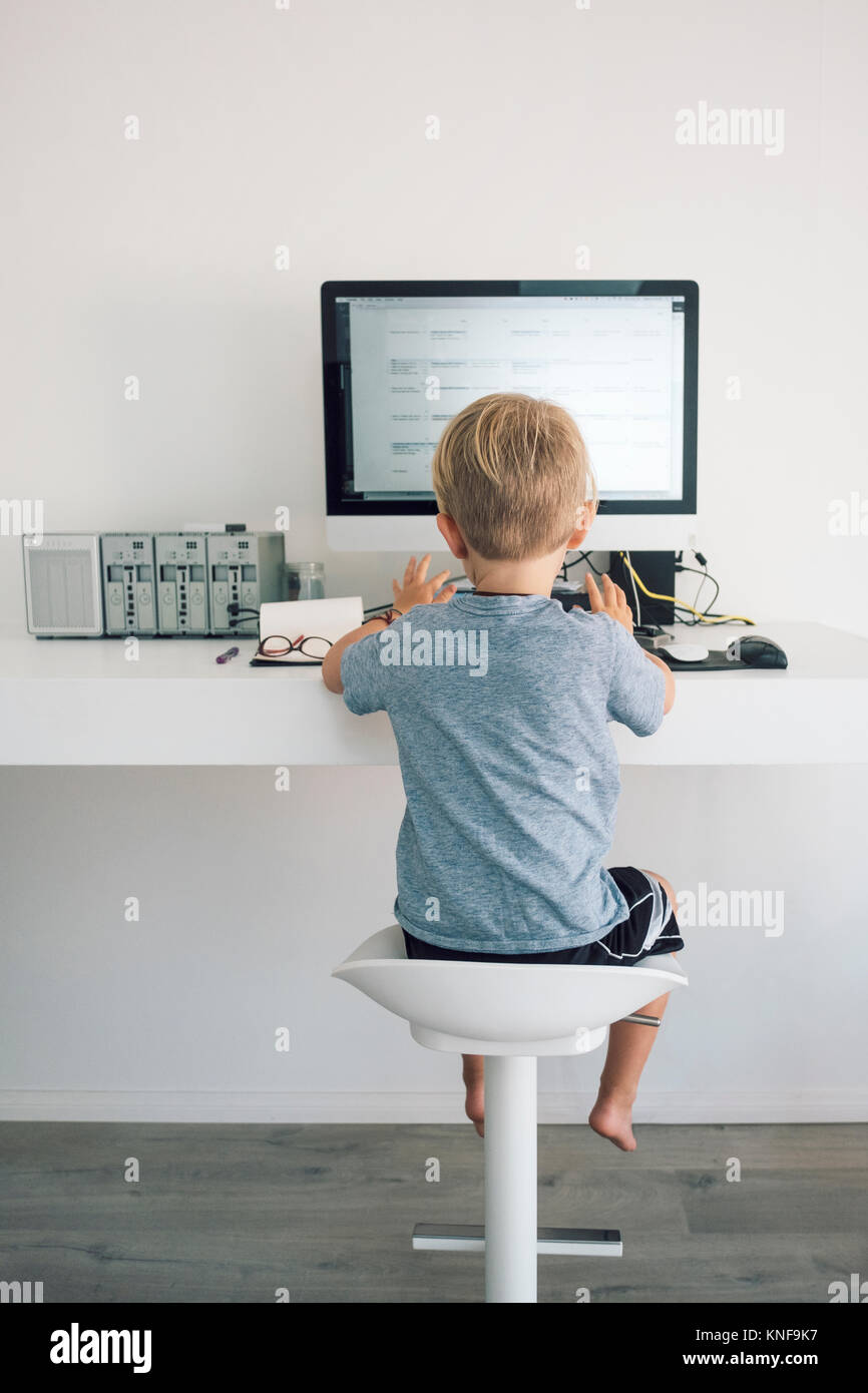Boy computer typing hi-res stock photography and images - Alamy