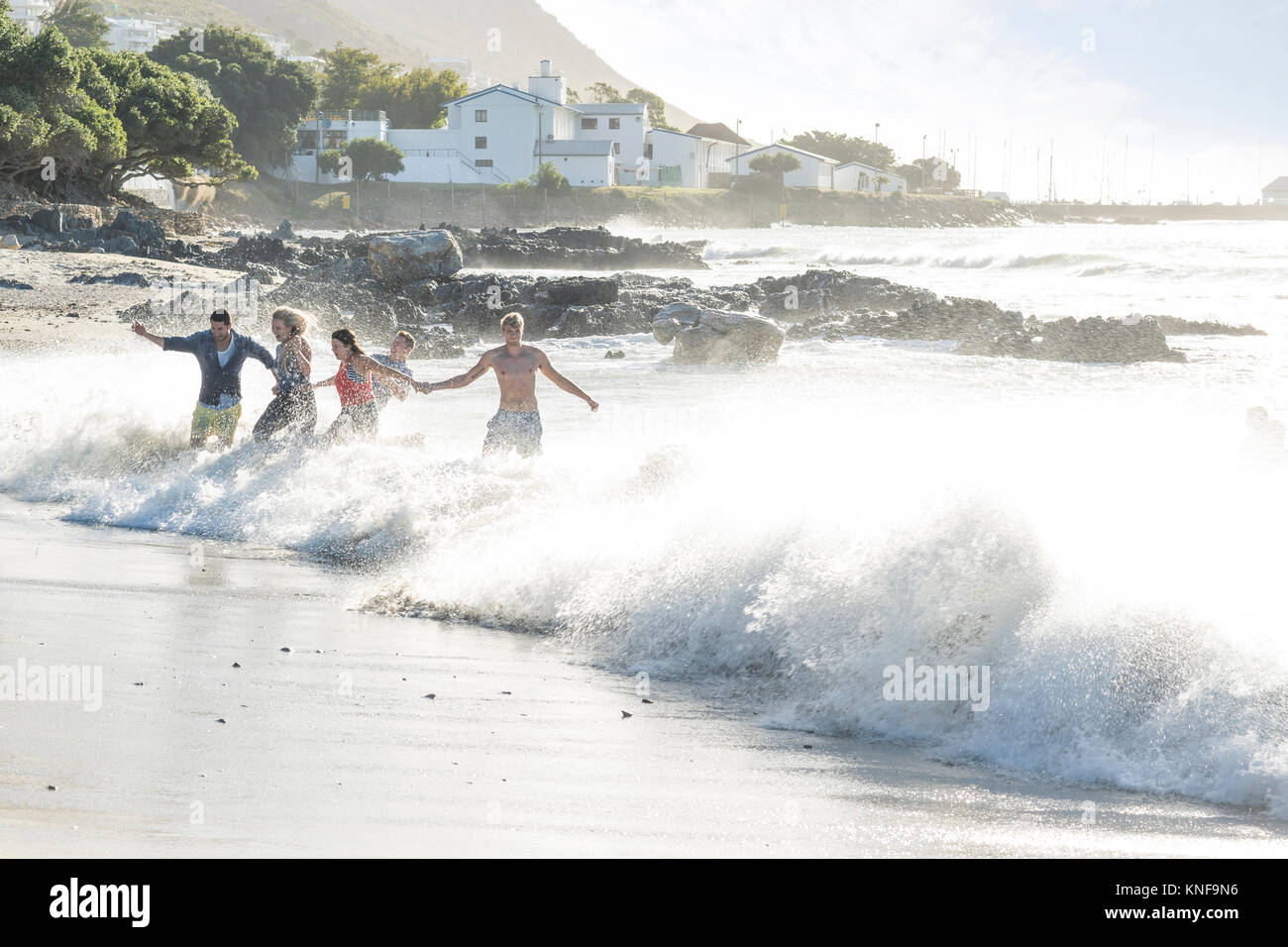 Man running from wave hi-res stock photography and images - Alamy