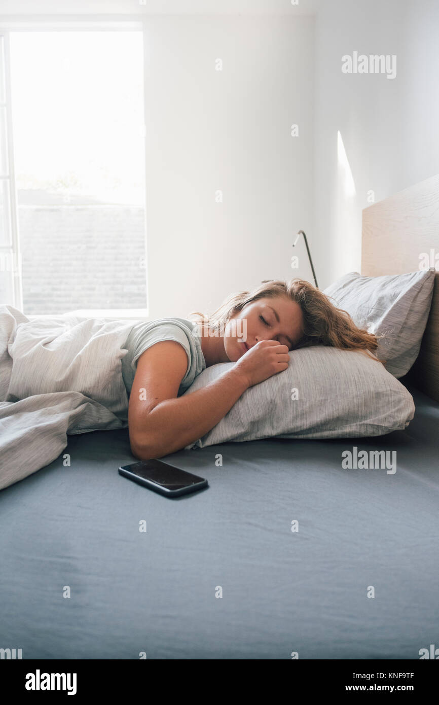 Woman asleep bed hi-res stock photography and images - Alamy