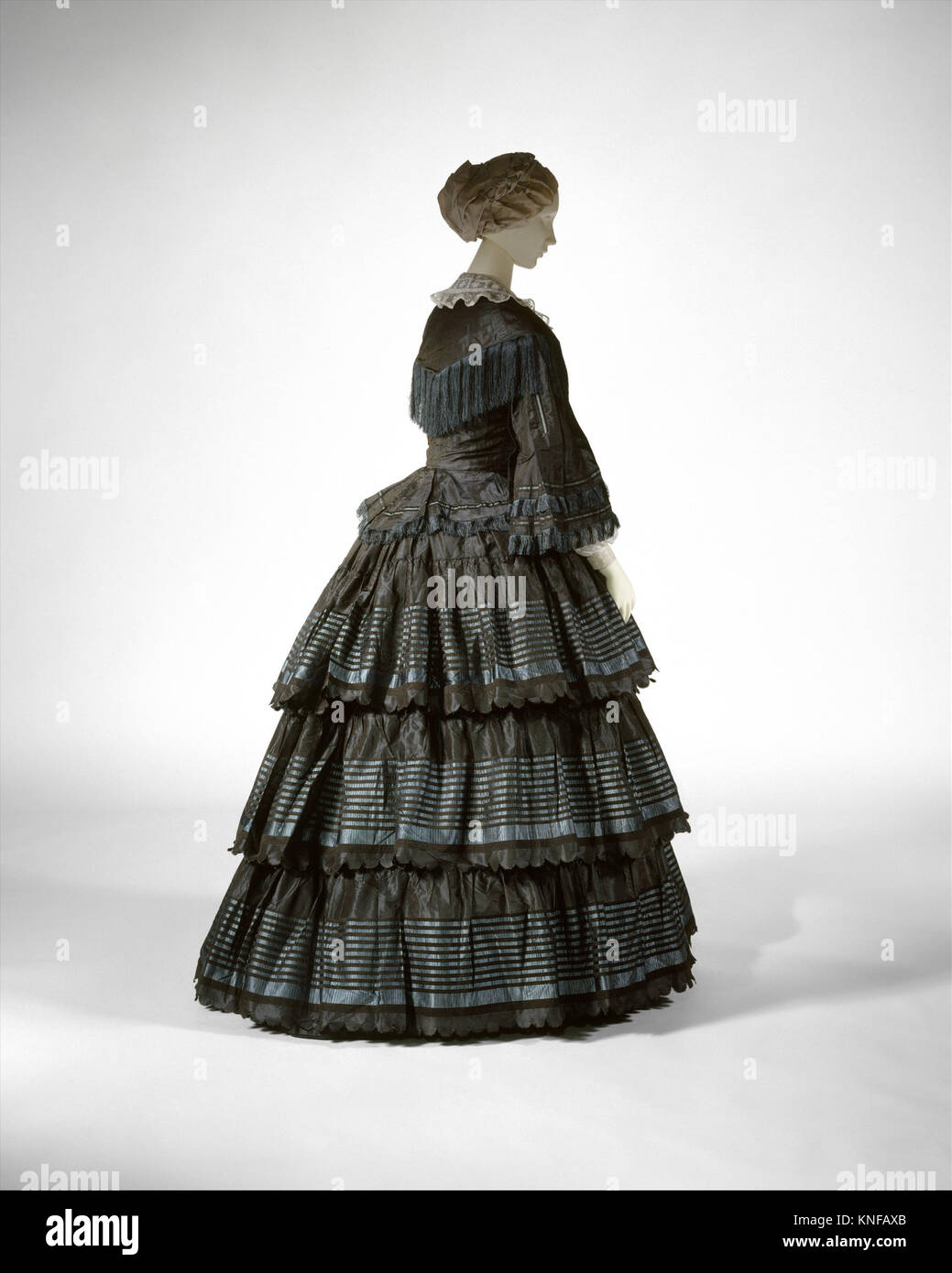 This historical dress illustrates period fashion, textile techniques ...