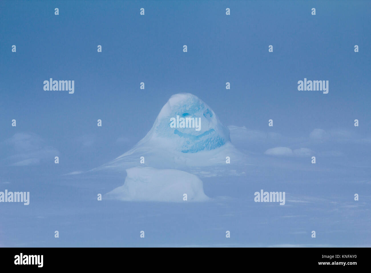 A smiley face drawn over blue ice in Antarctica Stock Photo - Alamy