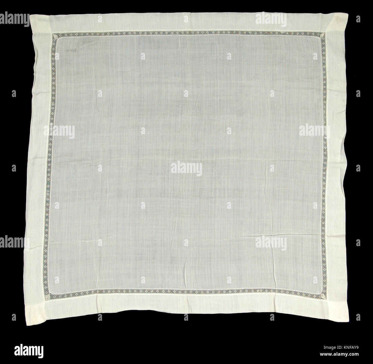 This handkerchief, crafted with intricate designs, exemplifies the ...