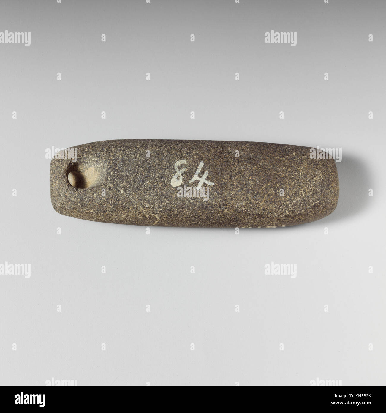 This basalt whetstone was used to sharpen tools or weapons, reflecting ...