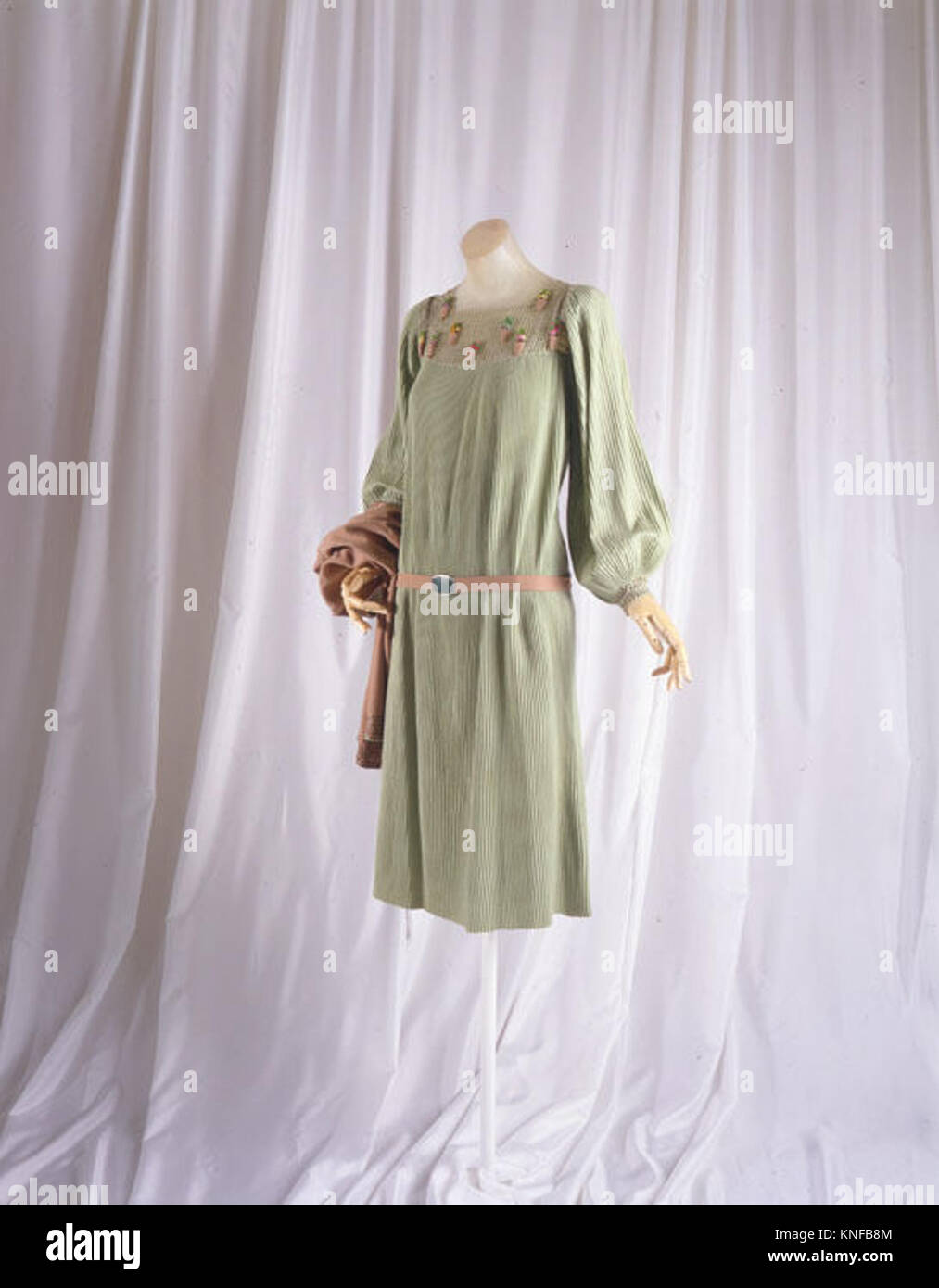 This historical ensemble illustrates detailed craftsmanship, materials ...