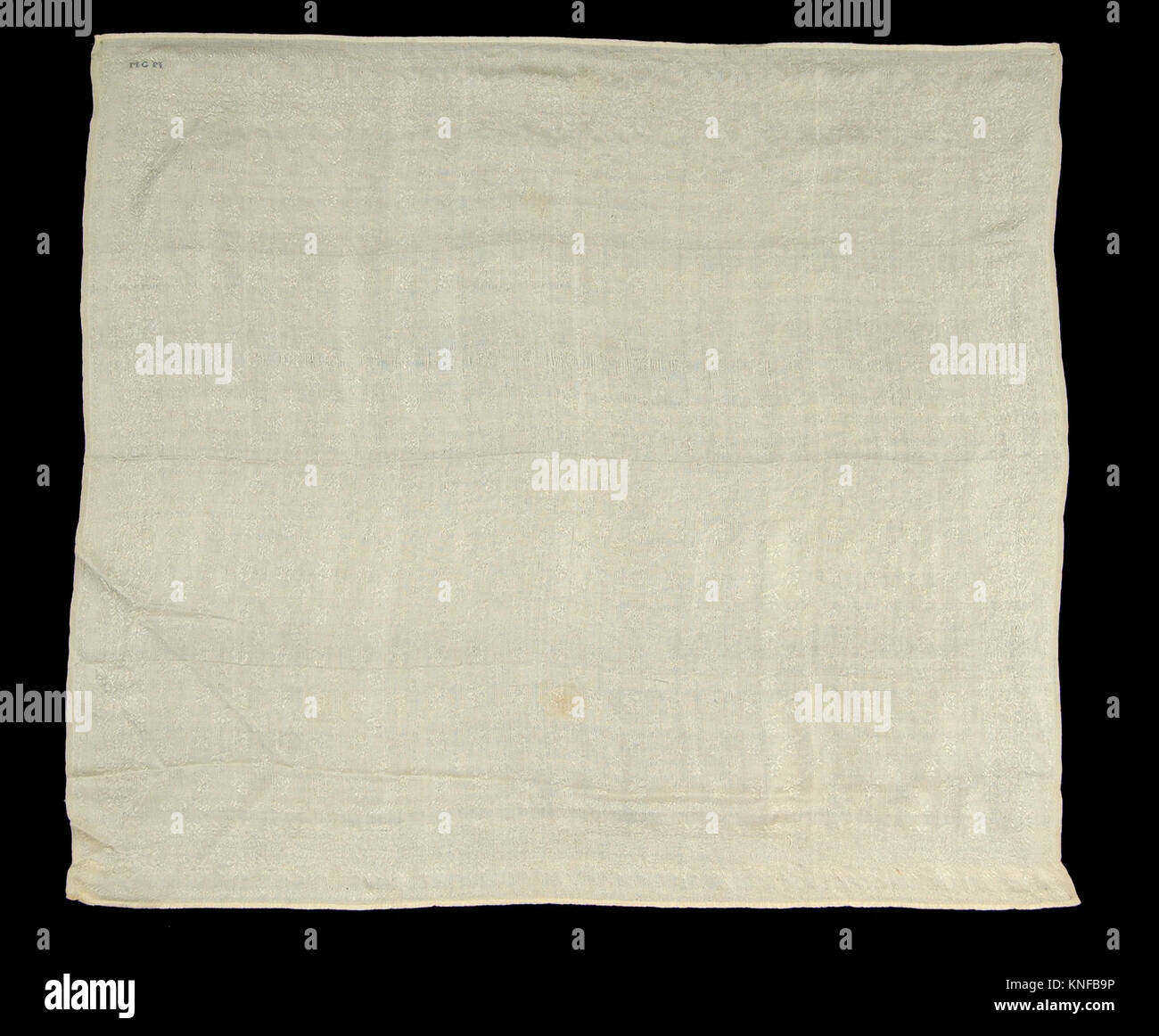 This handkerchief, made from fine materials, showcases intricate design ...