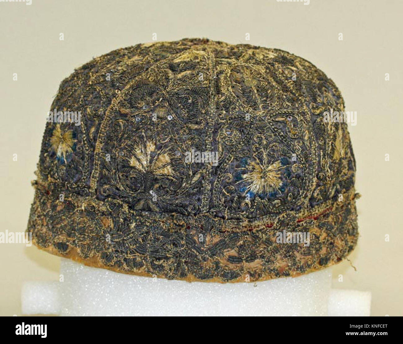 This cap is a historical garment from the period, designed for both ...