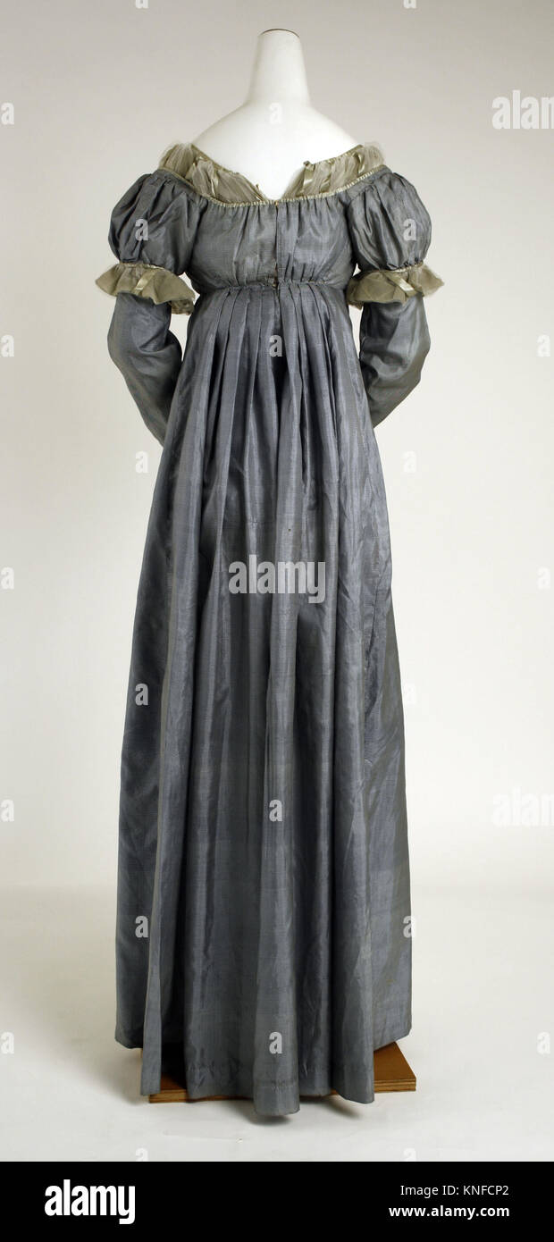 This dress is a historical example of garment design, reflecting the ...