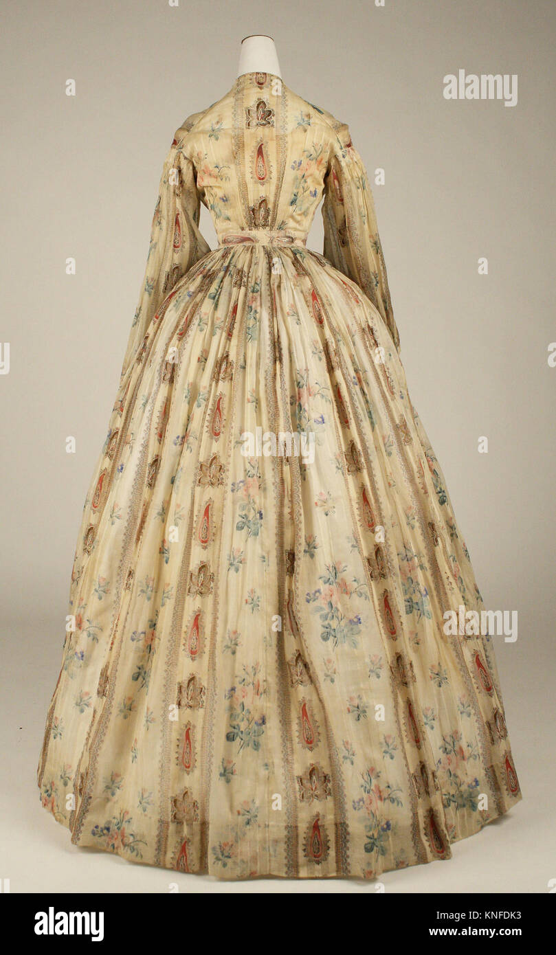 This dress, crafted with fine textiles, is an example of clothing from ...