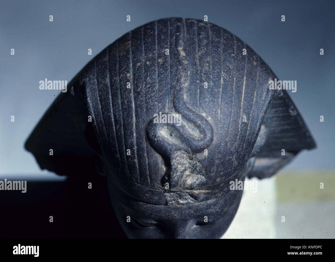A head from a statuette of a king, reflecting royal iconography and the ...