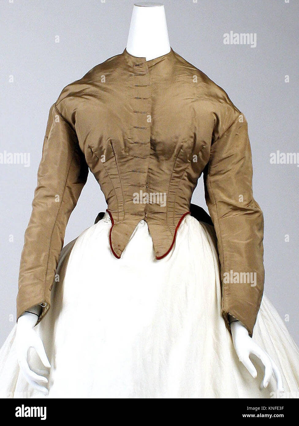 This ensemble is a complete outfit featuring garments and accessories ...