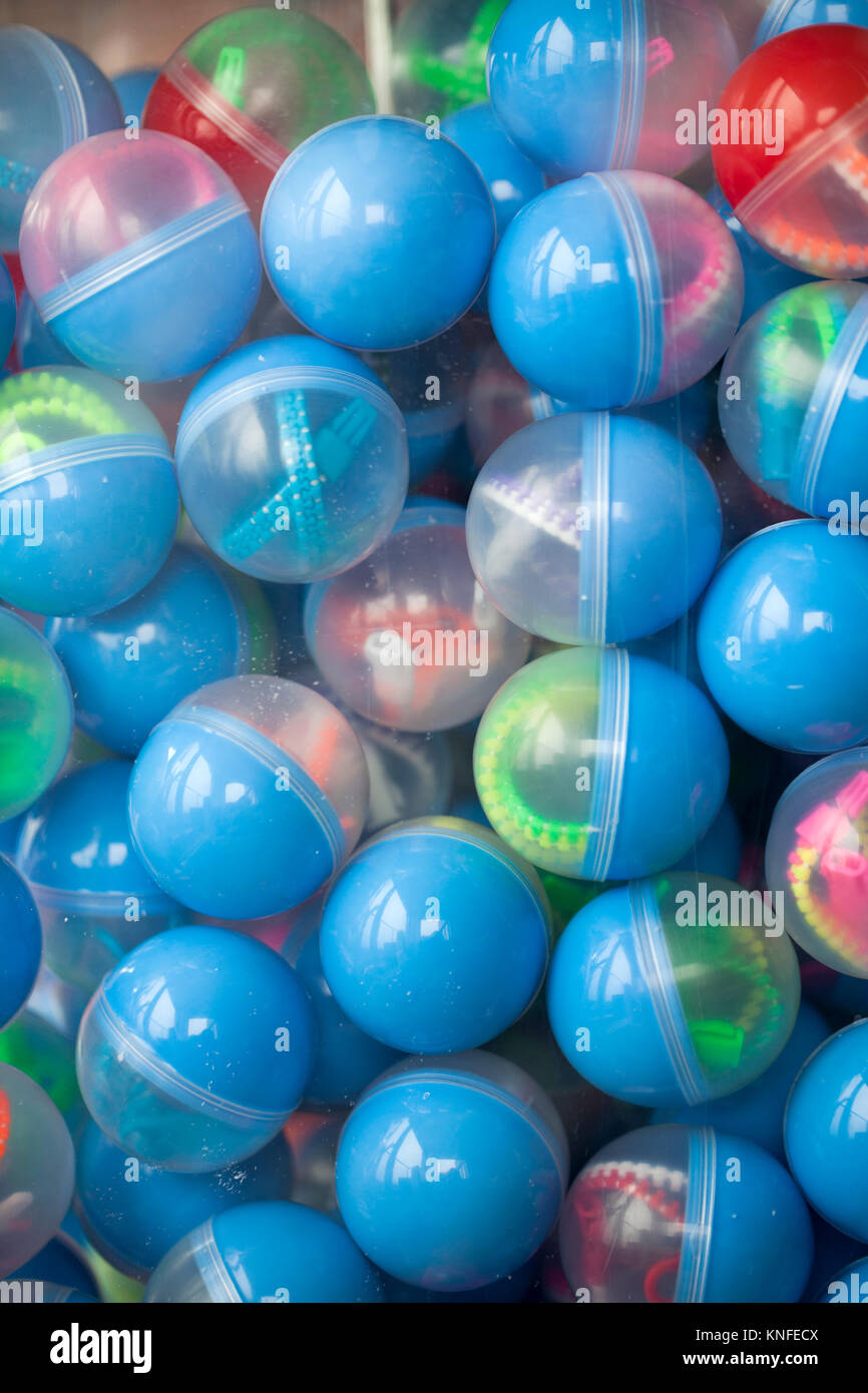 colored capsules with a toy Stock Photo - Alamy
